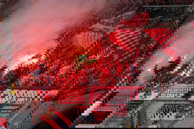 Bengalos pyrotechnics smoke rises in the Freiburg fan block Germany ...