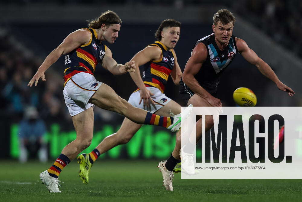 AFL POWER CROWS, Sam Berry of the Crows breaks away from Ollie Wines of ...