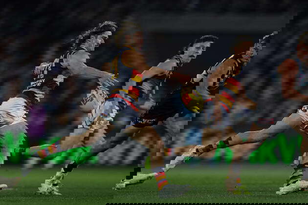 AFL POWER CROWS, Sam Berry of the Crows breaks away from Ollie Wines of ...