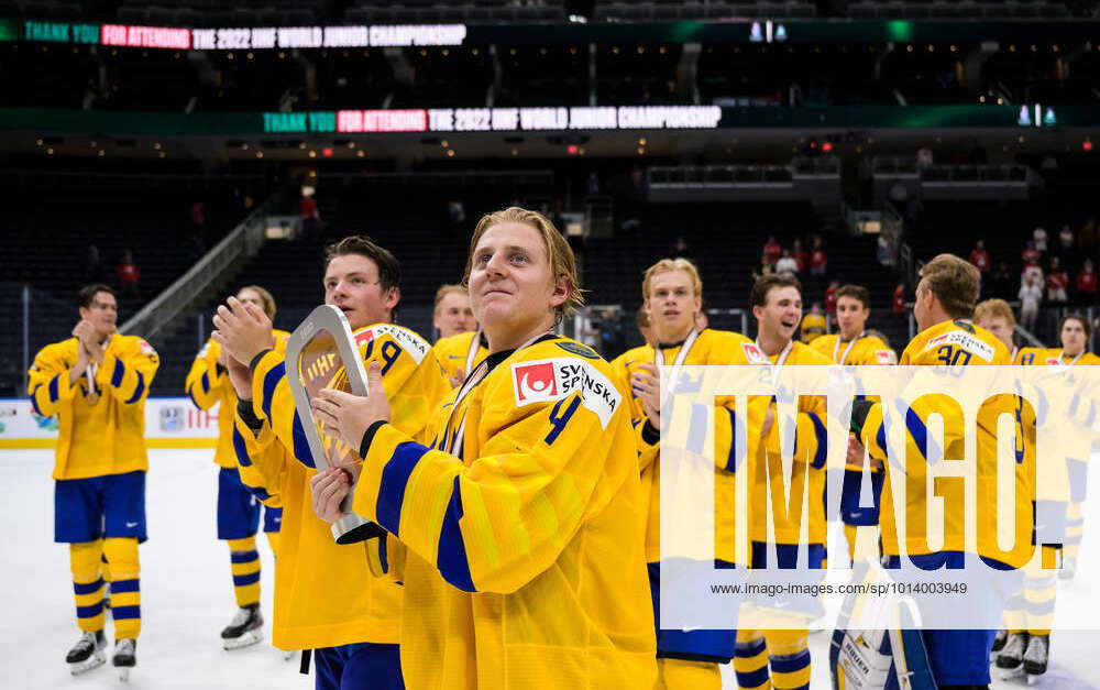 220820 Emil Andrae of Sweden with the bronze trophy after the 2022 IIHF ...