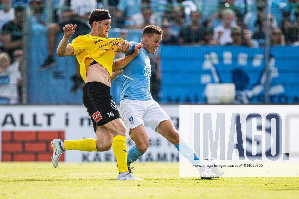 220821 Mjällbys Jacob Bergström and Malmö FFs Niklas Moisander during ...
