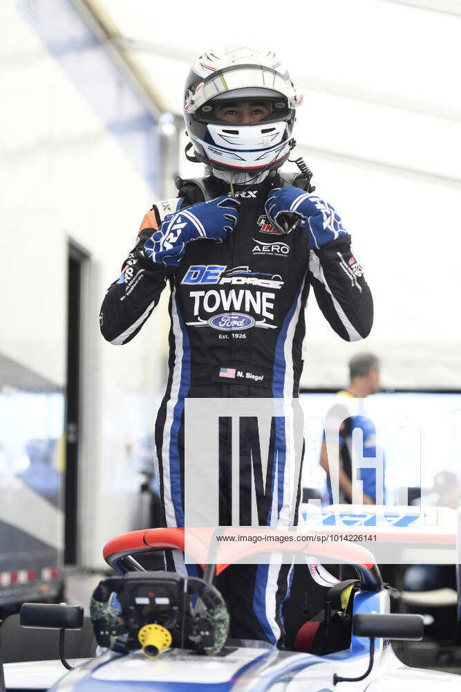 MADISON, IL - AUGUST 19: Nolan Siegel climbs into his car to practice ...