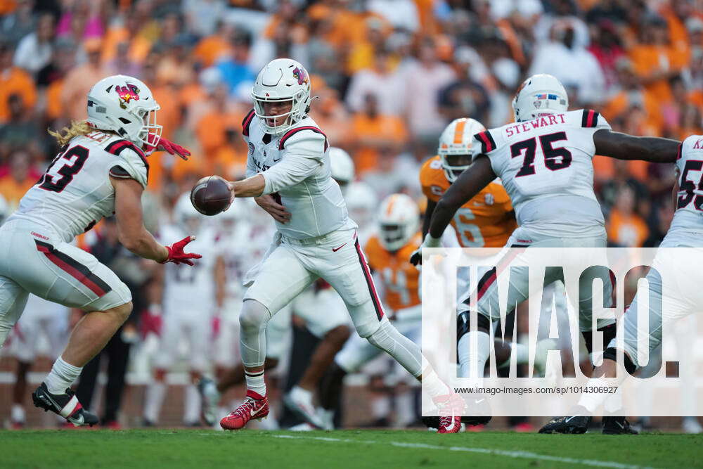 : John Paddock 5 looks to hand the ball off to Carson Steele 33 of the ...