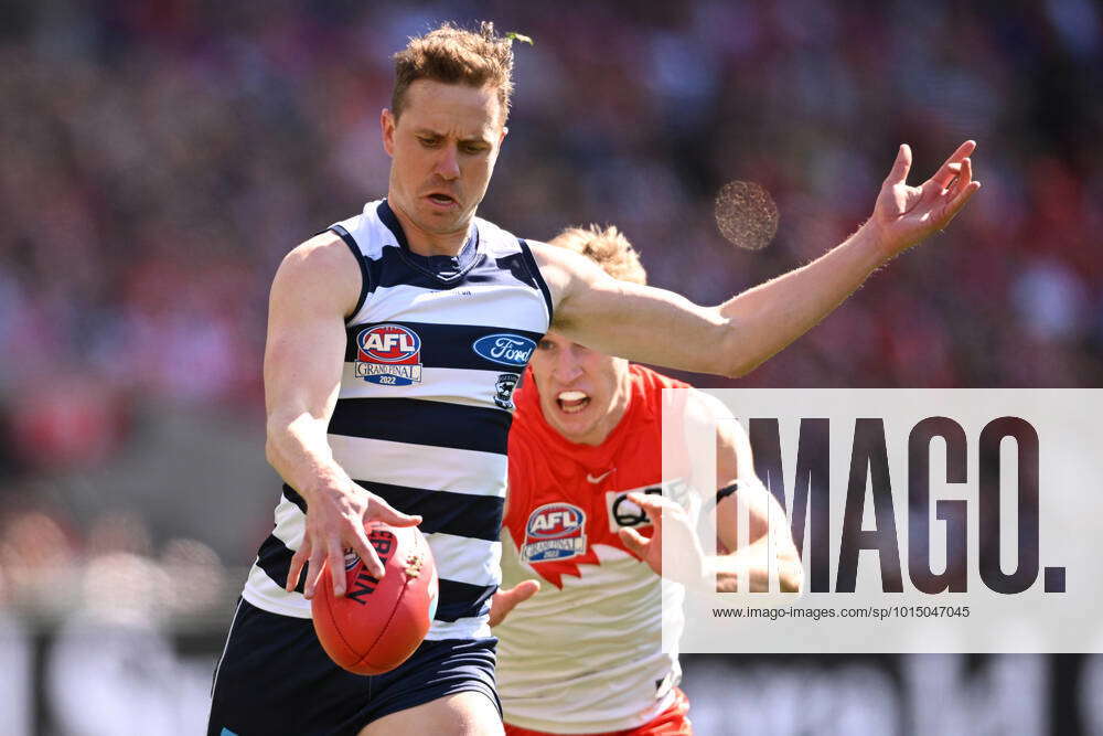 AFL GRAND FINAL, Mitch Duncan of Geelong (left) kicks the footy during ...