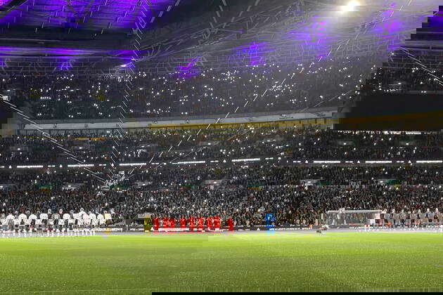Lighting with mobile light on the stands during the minutes silence for ...