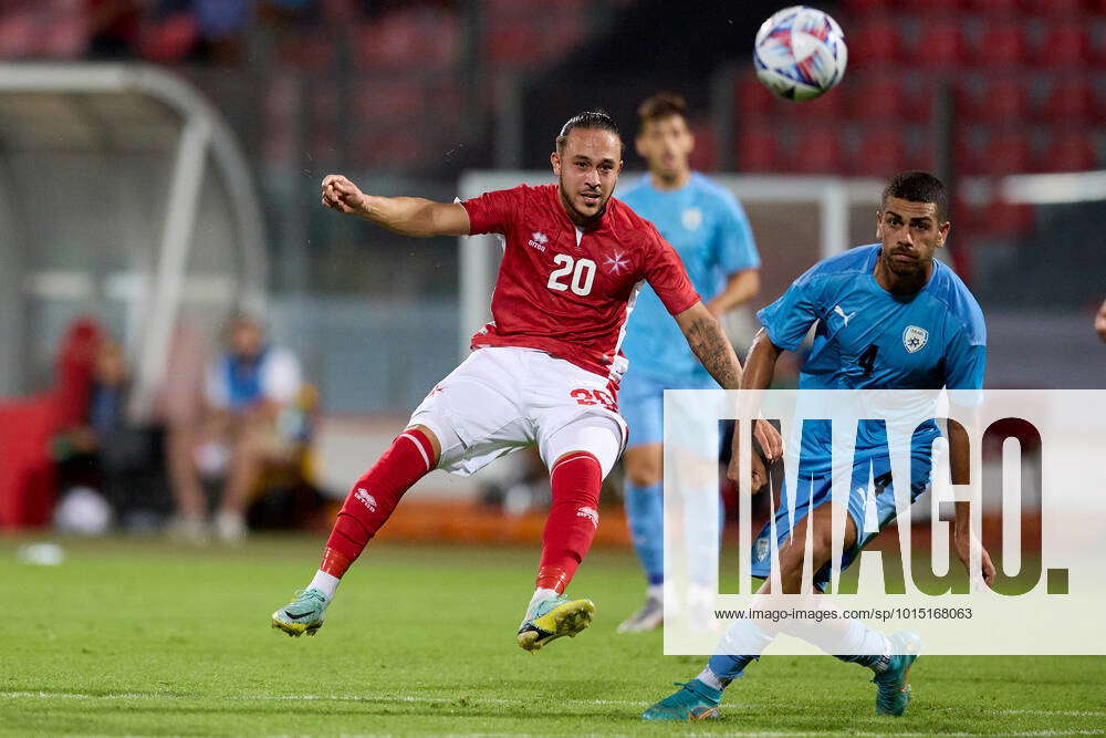 Malta national soccer team player Jodie Jones (L) shoots at goal during ...