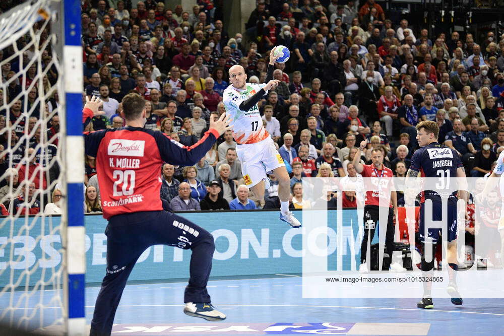 Tim Hornke SC Magdeburg, No17 in front of goalkeeper Kevin Möller SG ...