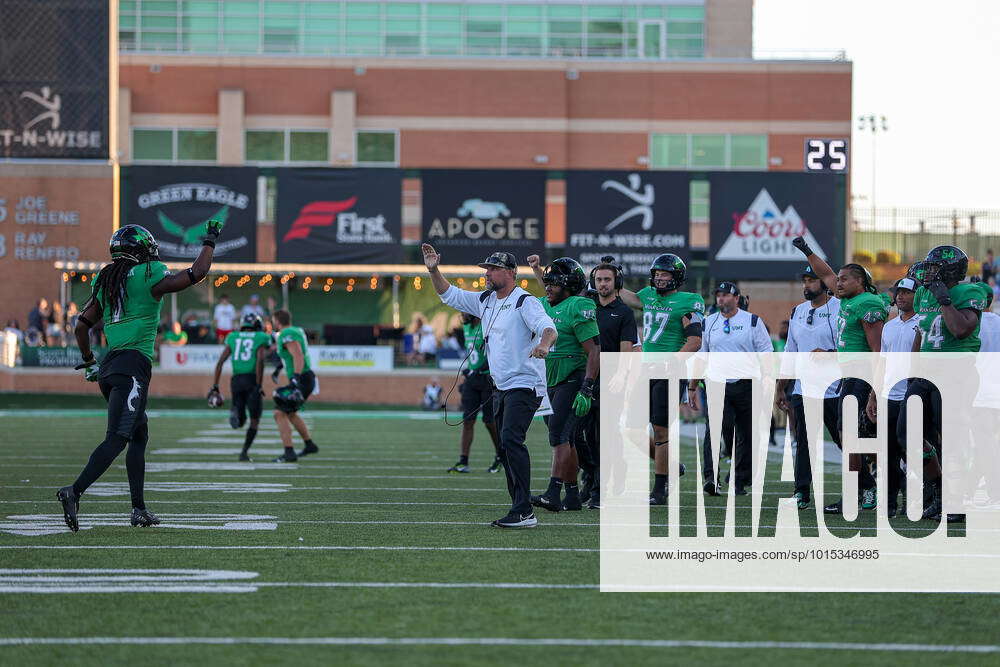 : North Texas Mean Green sideline celebrates after a fourth down during ...