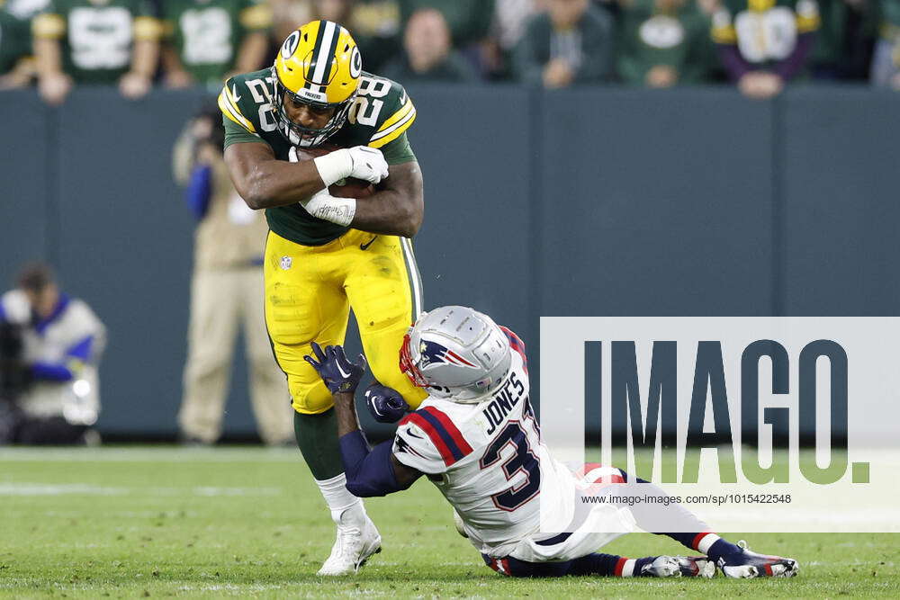 : Green Bay Packers running back AJ Dillon runs over New England ...