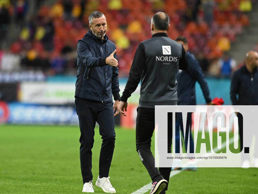 Mihai Stoica greets reserve referee Viorel Nicusor Flueran after the ...
