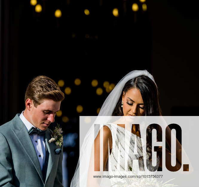 Remco Evenepoel helps his wife Oumaima Oumi Rayane with the long veil ...