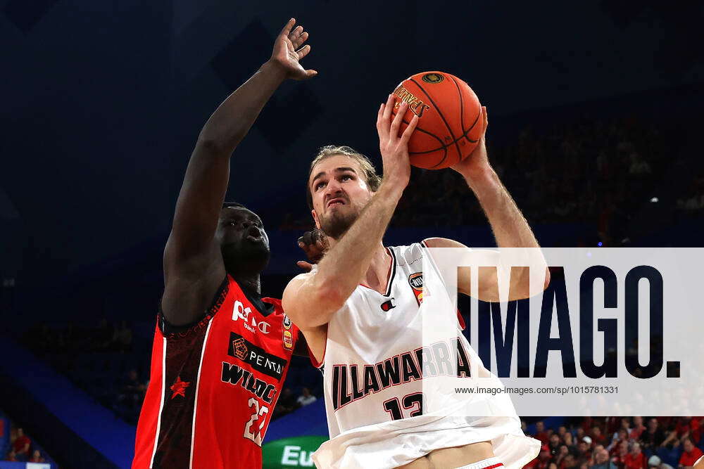 NBL WILDCATS HAWKS, Sam Froling of the Hawks drives past Majok Majok of ...