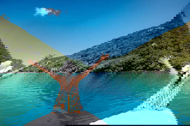 Young woman view to the cliffy rocks of Verdon Gorge at lake of Sainte ...