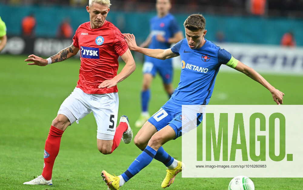Oliver Sonne and Octavian George Popescu in the football match between ...