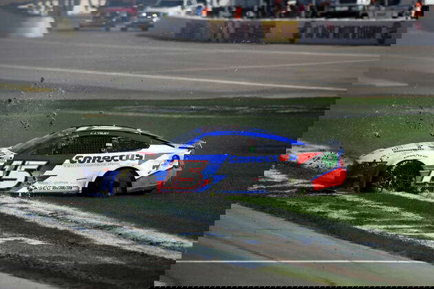 LAS VEGAS, NV - OCTOBER 16: JJ Yeley slides through the infield grass ...