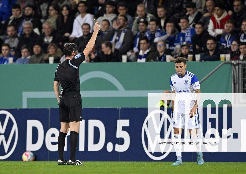 Referee Referee Dr Matthias Joellenbeck shows Jordan Larsson FC Schalke ...