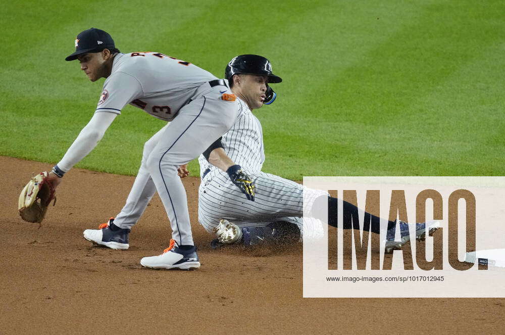 New York Yankees Giancarlo Stanton slides into second past Houston ...