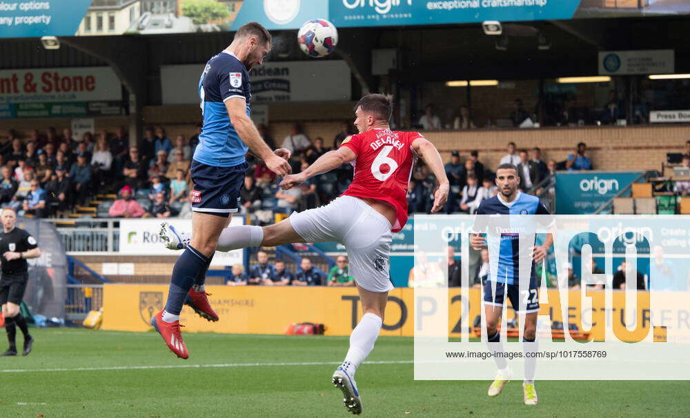 Sam Vokes of Wycombe Wanderers wins the header from Ryan Delaney of ...