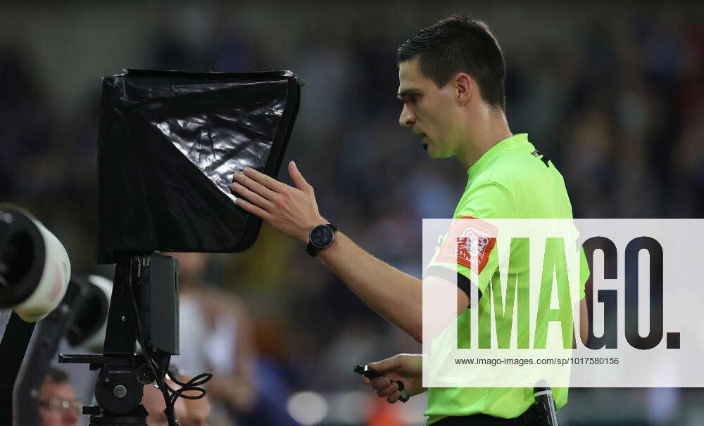 Referee Brent Staessens pictured watching a scene on the VAR video ...