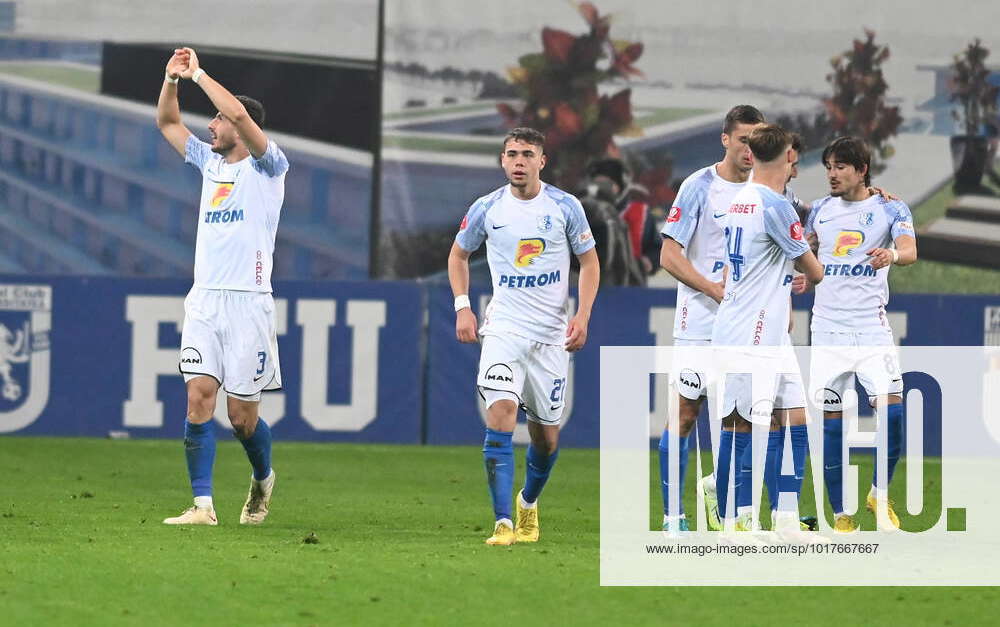 Mihai Popescu rejoices after a goal scored alongside Constanta footballers Sebastian Andrei Borza