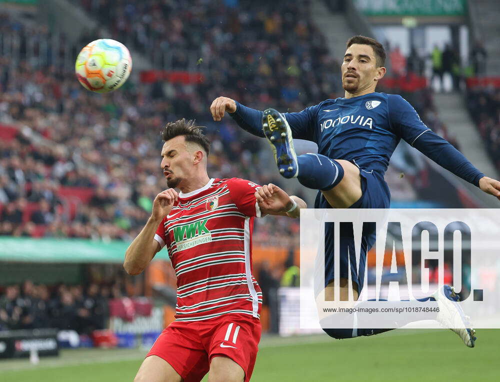 Danilo Soares VfL Bochum clears in front of Mergim Berisha FC Augsburg ...