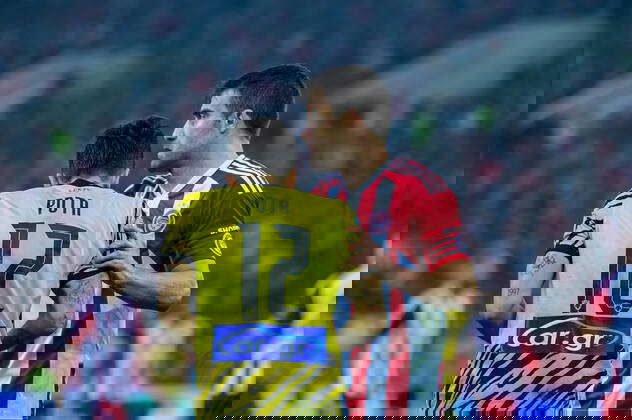 15 SOKRATIS PAPASTATHOPOULOS of Olympiacos FC with 12 LAZAROS ROTA of ...