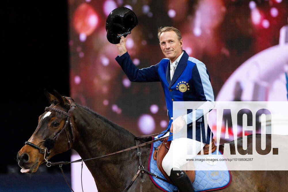 221127 Peder Fredricson of Sweden with horse Christian K celebrates ...