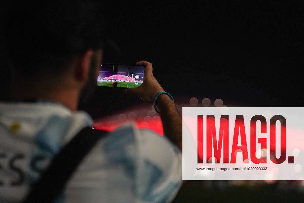 AL RAYYAN, QATAR - DECEMBER 3: Supporter of Argentina takes a photo of ...