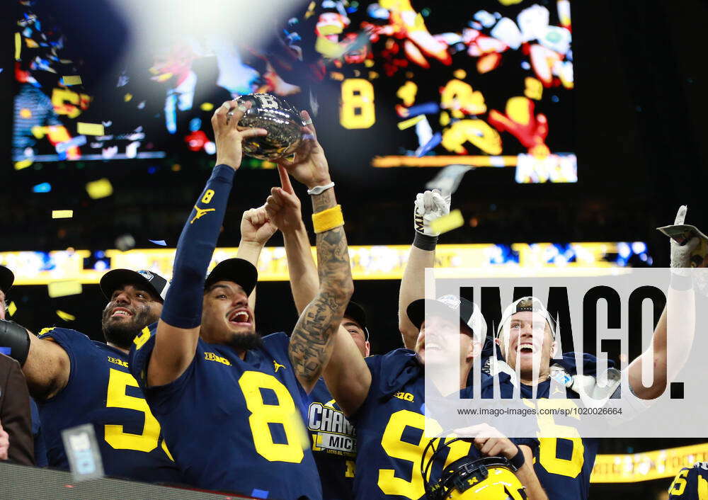 Michigan Wolverines players celebrate their Big Ten Championship against the Purdue Boilermakers in