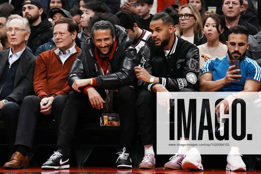 Toronto, ON, CAN: Colin Kaepernick, centre left, sits beside Akim Aliu ...