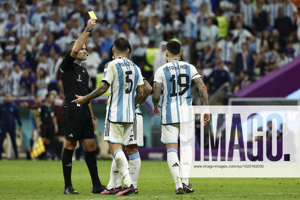 Spanish referee Antonio Mateu shows yellow card to Nicolás Otamendi ...