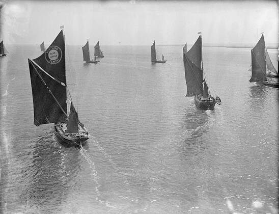 Picture from the air. Sailing barges in race on the Thames. 18 ...