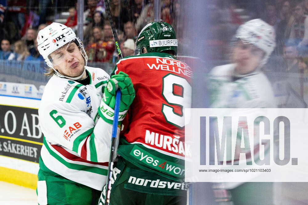 221228 Rögles Tony Sund and Frölundas Jan Mursak during the ice hockey match in the SHL between