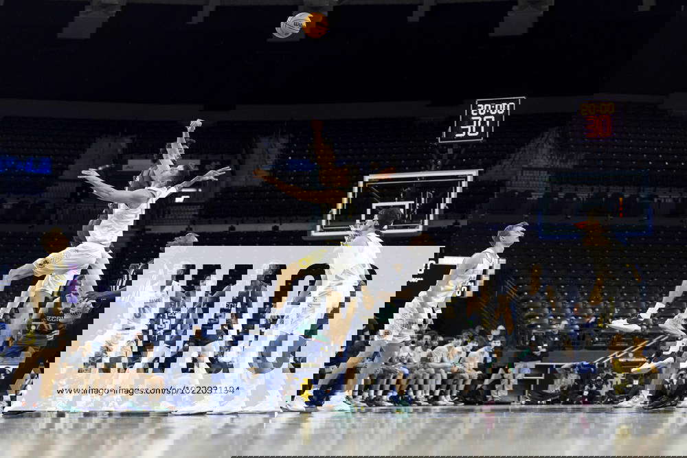 : The opening tip during NCAA, College League, USA basketball game ...