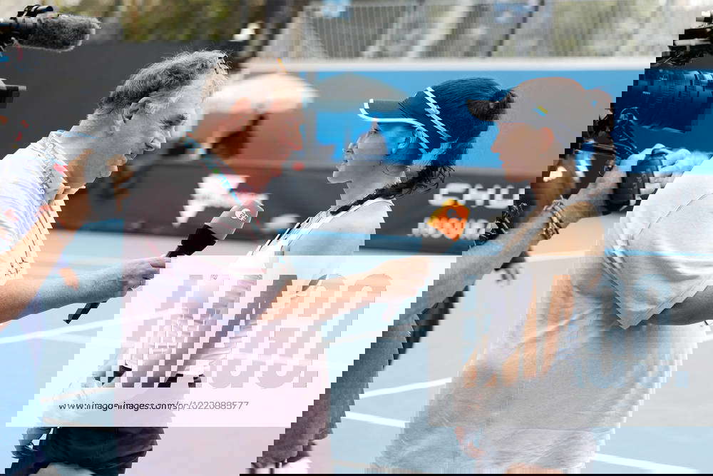 ZDF reporter Sven Goern does an on-court TV interview with Eva Lys ...