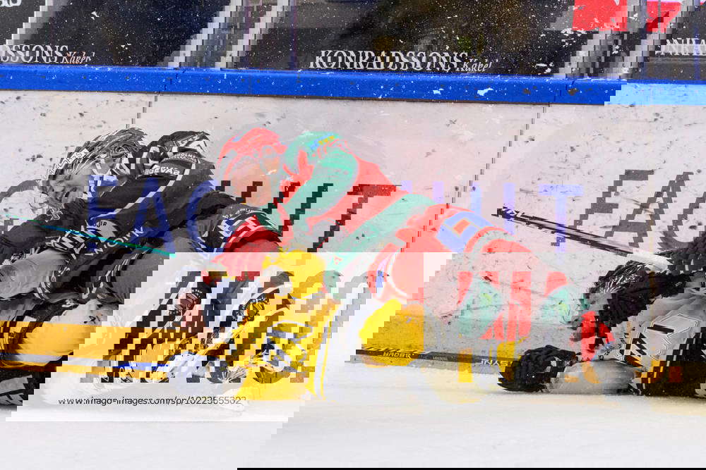 230120 HV71s Mattias Tedenby and Frölundas Andreas Borgman during the ice hockey match in the SHL