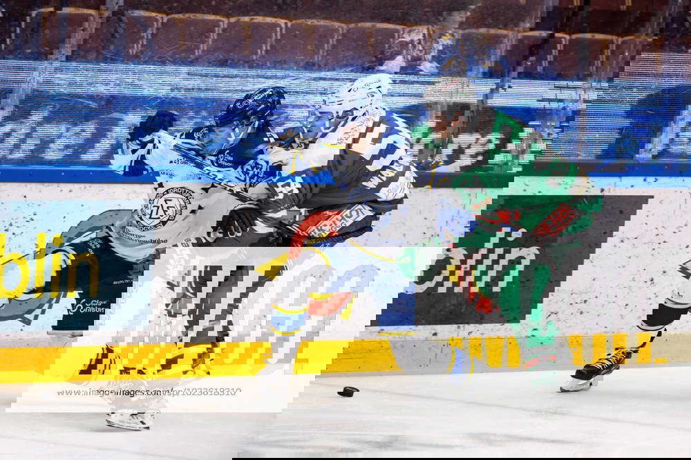 Leksands Carter Ashton and Rögles William Wallinder during the ice ...