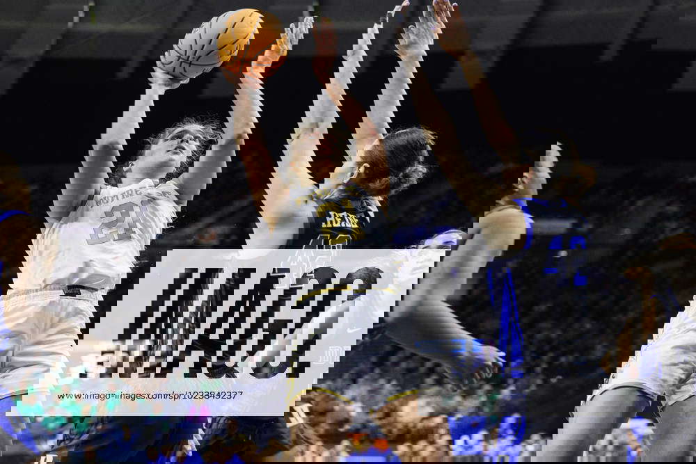 February 05, 2023: Notre Dame forward Maddy Westbeld (21) shoots the ball as Duke forward Mia Heide