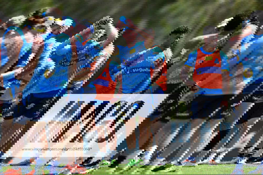 NRL TITANS TRAINING, Sam Verrills (centre) cools off during a Gold ...