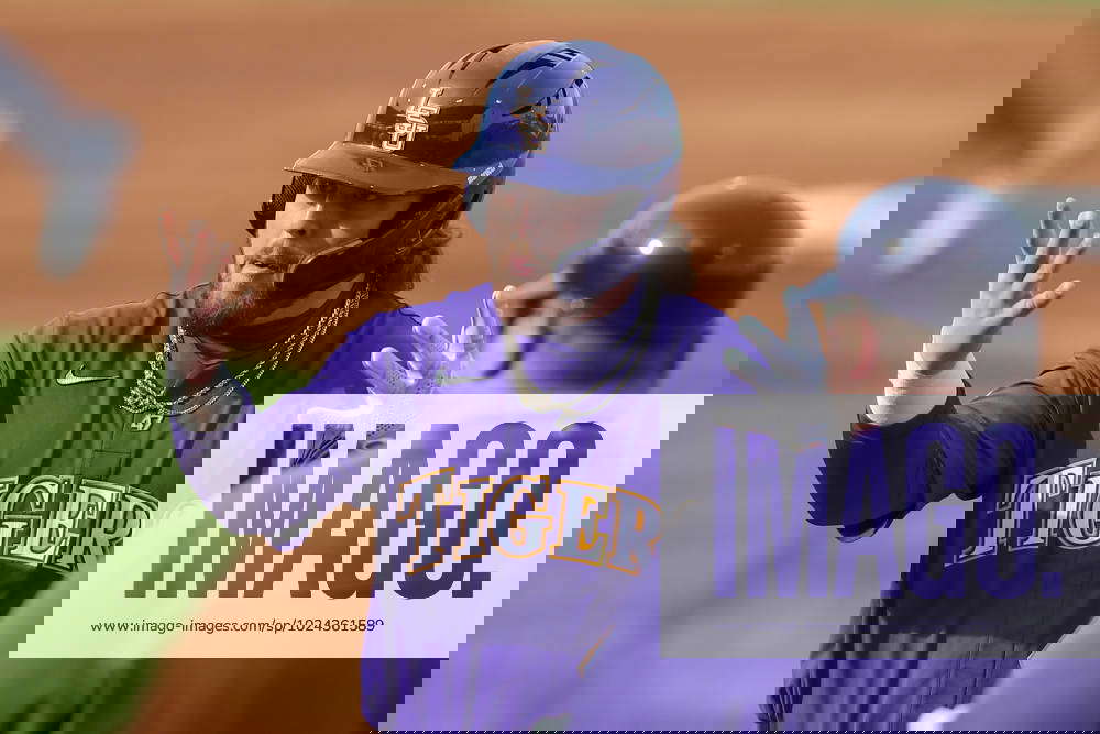 : LSU s Tommy White celebrates after a hit during NCAA, College League ...