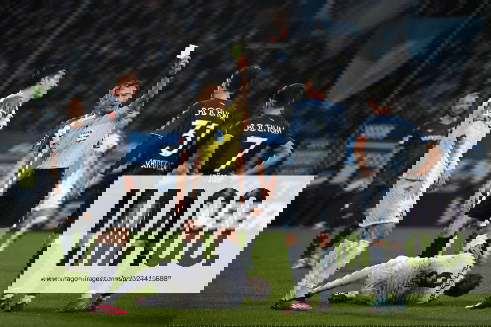 Referee Felix Zwayer shows Keven Schlotterbeck VfL Bochum the yellow ...