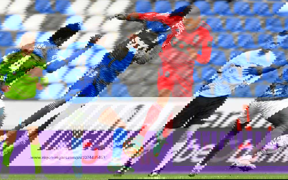 Jong Genk s Mohammed Aziz Quattara and SL16 s Sacha Banse pictured in ...