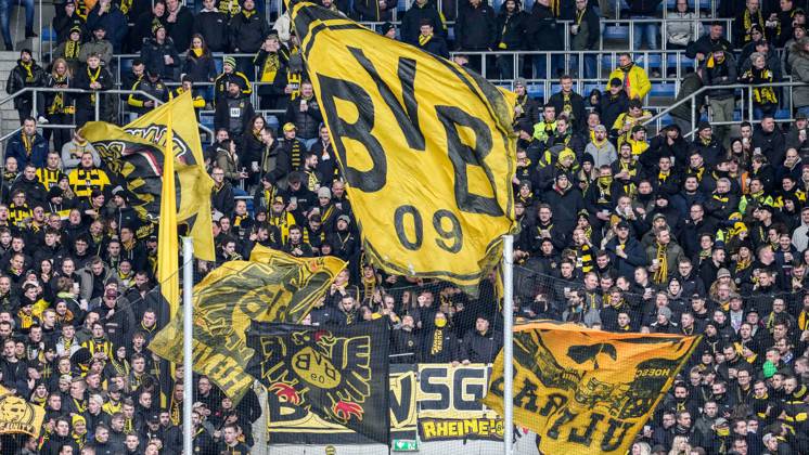 The traveling Ultras of Borussia Dortmund BVB 09 in the guest block ...