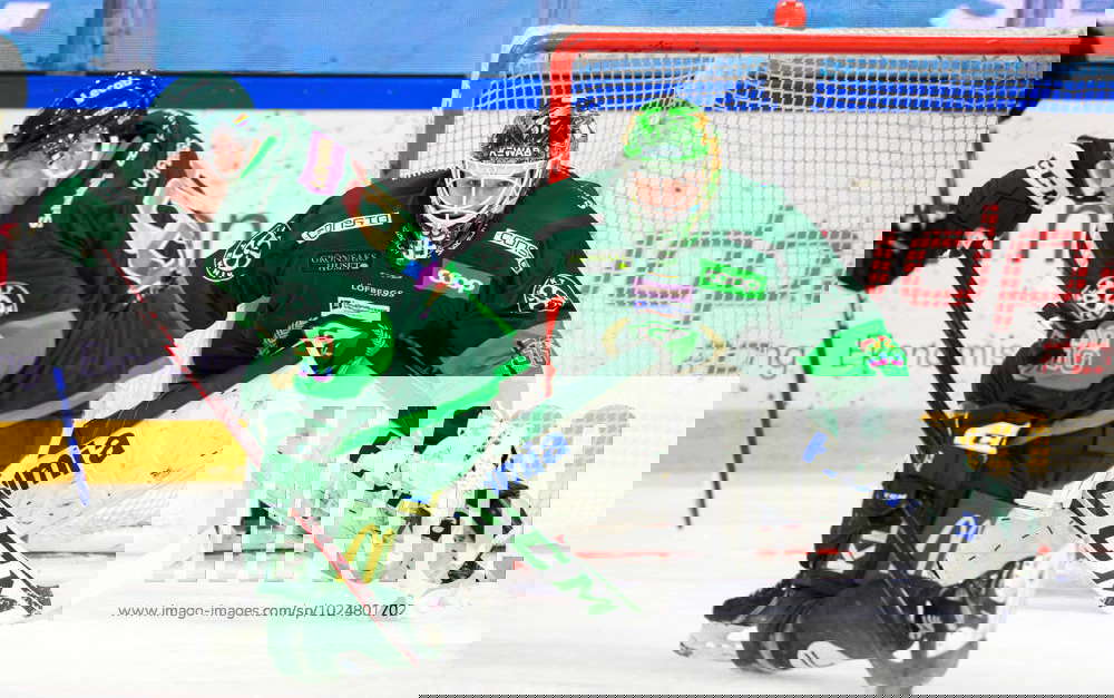 230225 Färjestads Brandon Davidson covers shots and goalie Dennis ...