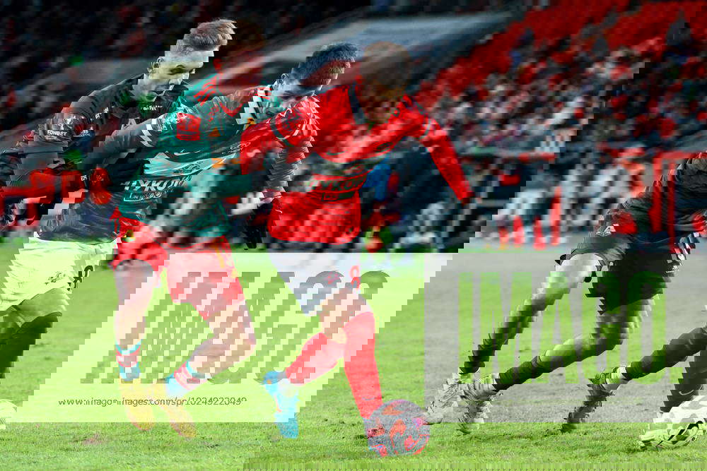 RUSSIA, MOSCOW - : Lokomotiv Moscow s Maxim Glushenkov and Spartak Moscow s Daniil Khlusevich in