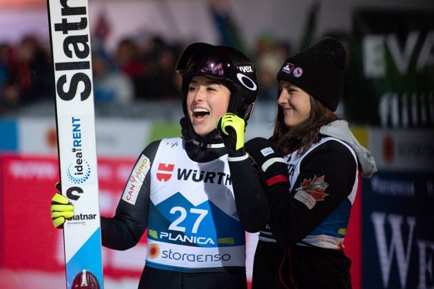 World champion Alexandria Loutit Canada cheers at the finish line with ...