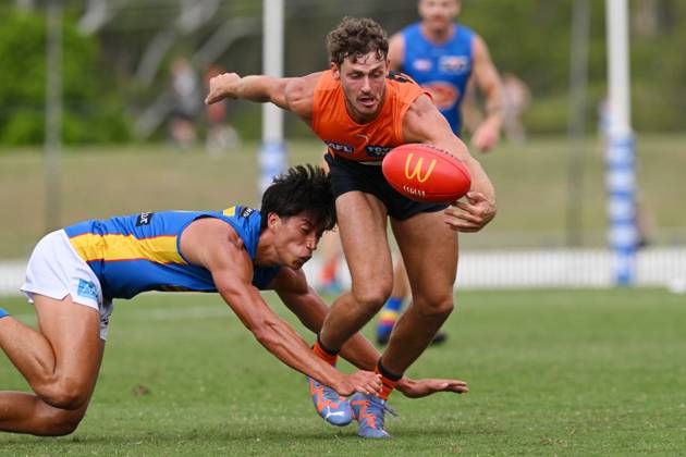AFL GIANTS SUNS, Harry Perryman of the Giants and Alex Davies of the ...