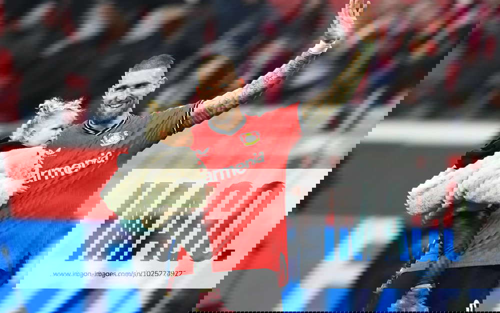 Robert Andrich Bayer 04 Leverkusen greets the fans with his daughter on ...