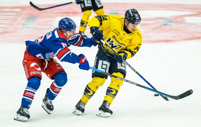 Oskarshamns Niclas Burström and HV71s Oliwer Kaski during match two in the SHL qualifier between