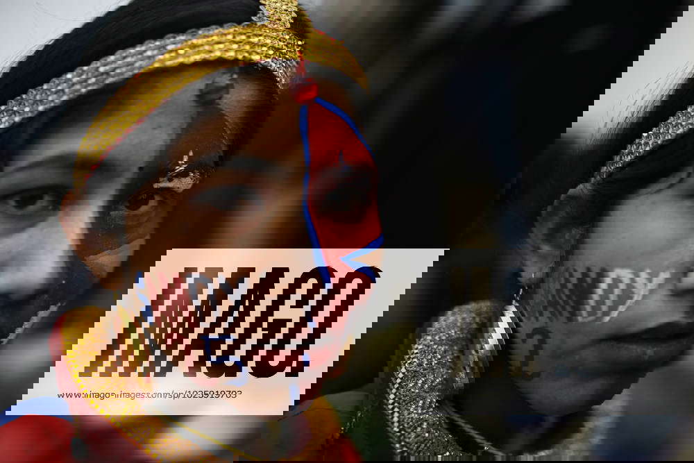 Kirtipur, Nepal: A fan with the Nepali flag painted on her face looks ...